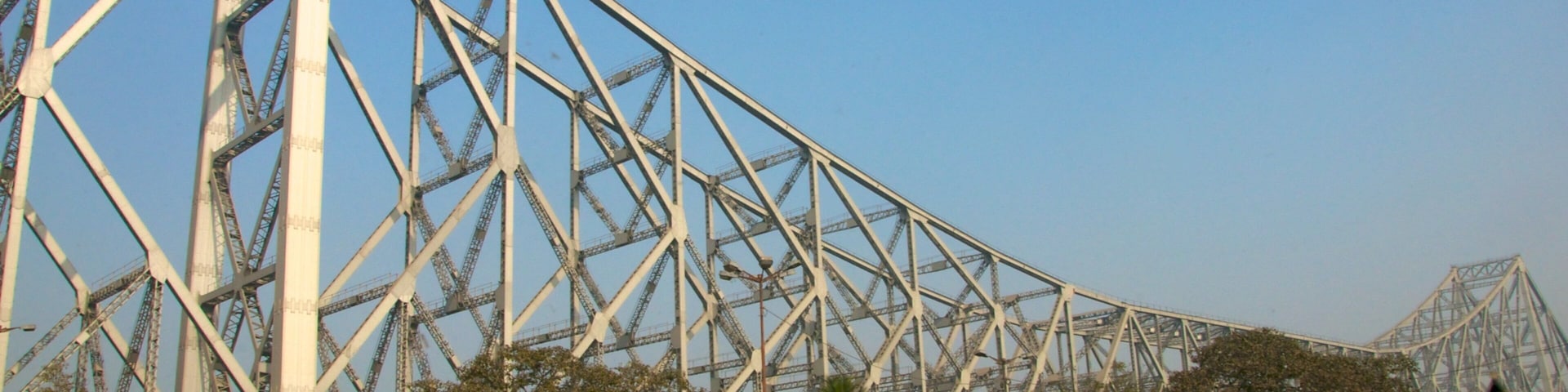 Howrah Bridge showing a bridge, street scenes and a city
