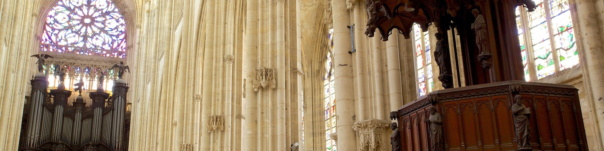 Saint-Ouen Church featuring a church or cathedral and interior views