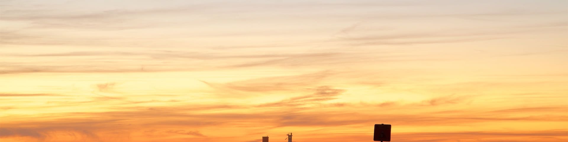 Barra Beach which includes a sunset and general coastal views