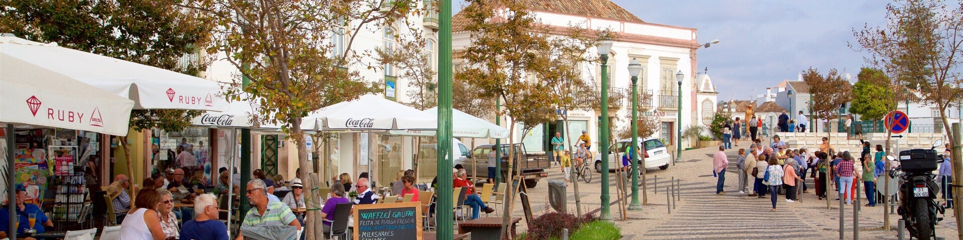 Praca da Republica which includes outdoor eating as well as a small group of people