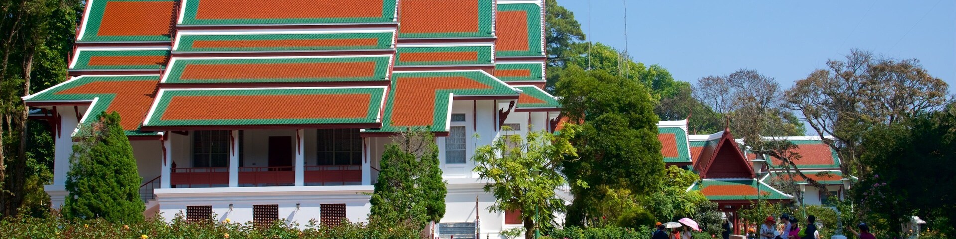 Bhuping Palace which includes chateau or palace and a park as well as a small group of people