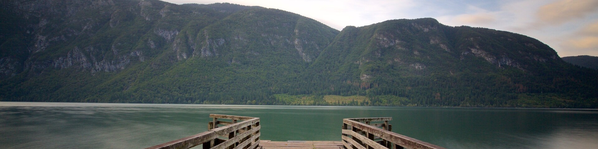 Lake Bohinj featuring mountains and a lake or waterhole