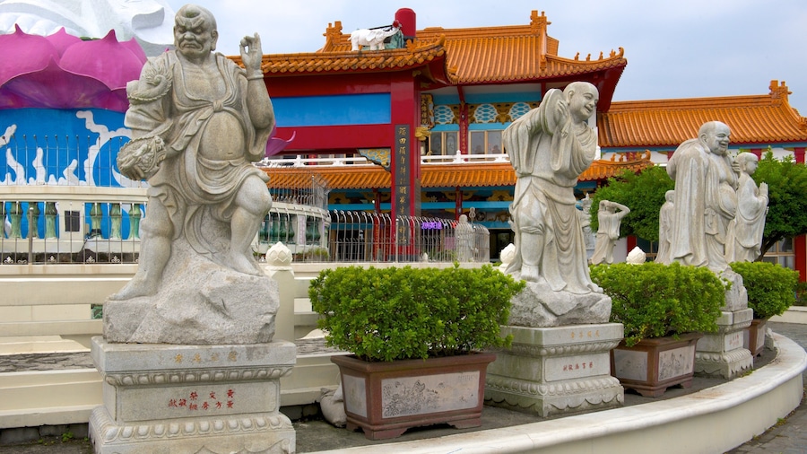 Statue of Guanyin which includes religious aspects and a statue or sculpture