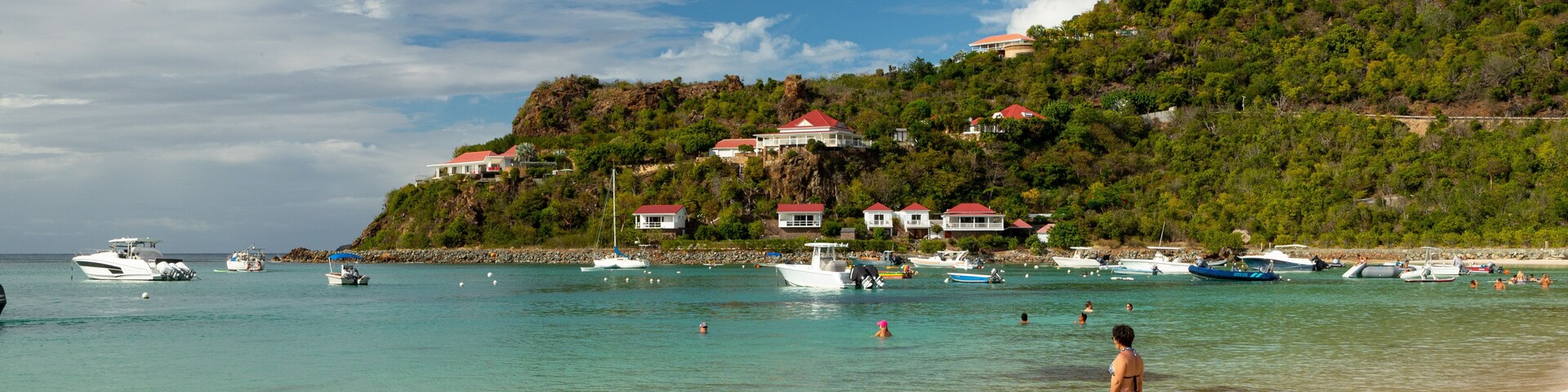 St. Jean Beach showing a coastal town, general coastal views and swimming