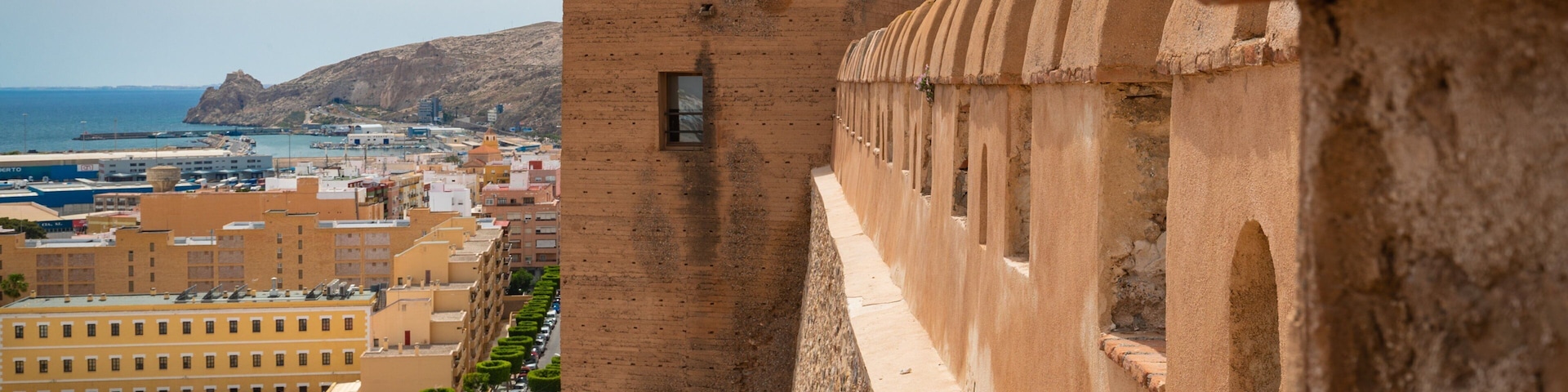 Alcazaba which includes heritage elements and a coastal town