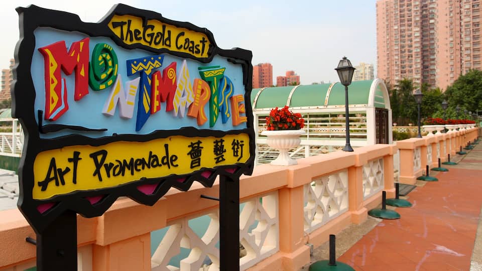 Golden Beach featuring a city and signage