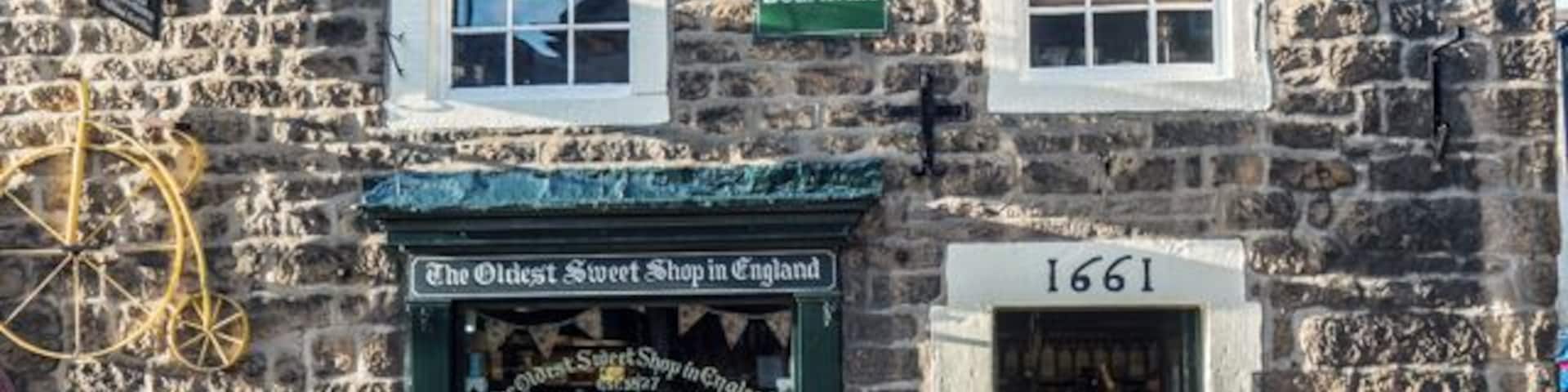 Located in Pately Bridge, Yorkshire Dales, sweets have been sold here continuously since 1827. It is officially the oldest sweet shop in the world.
The interior of the shop, full of boiled sweets, chocolates, snakes etc made to original recipes, is almost the same as it was a century ago.