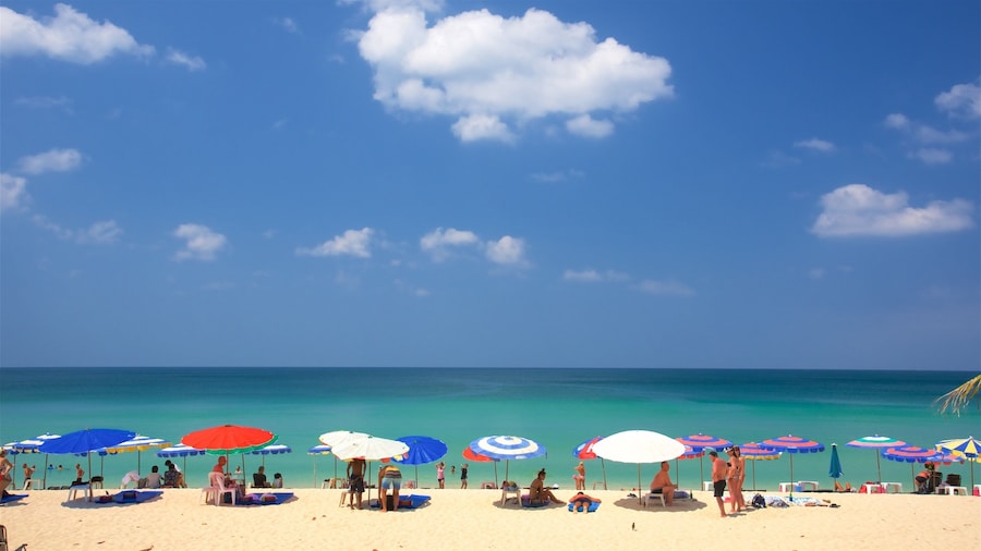 Surin Beach which includes a sandy beach and a pebble beach as well as a small group of people