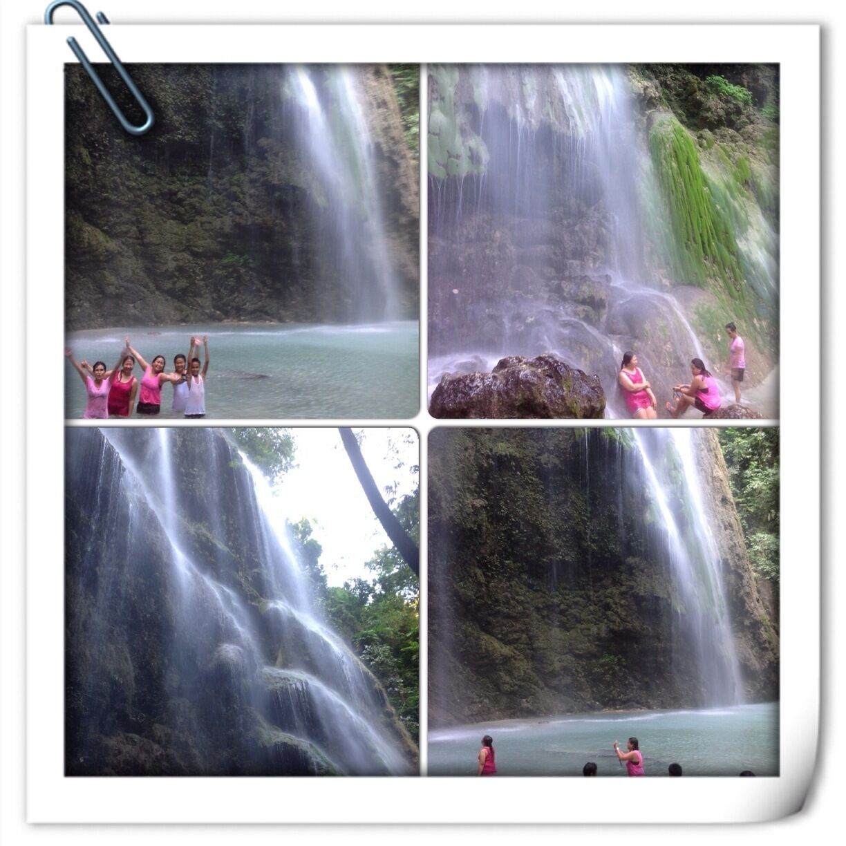 Uma cascata com pessoas apreciando a paisagem.