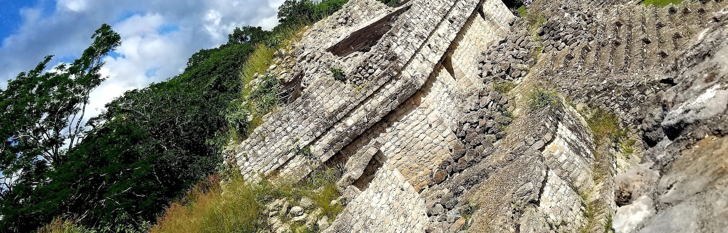 Ek Balam, now a protected ecological site in Mexico, was a predominant Mayan city between 550 AD and 850 AD with 12,000 inhabitants. The Acropolis, formerly a place of knowledge and learning, shown in the distance, features 106 steps to its peak.