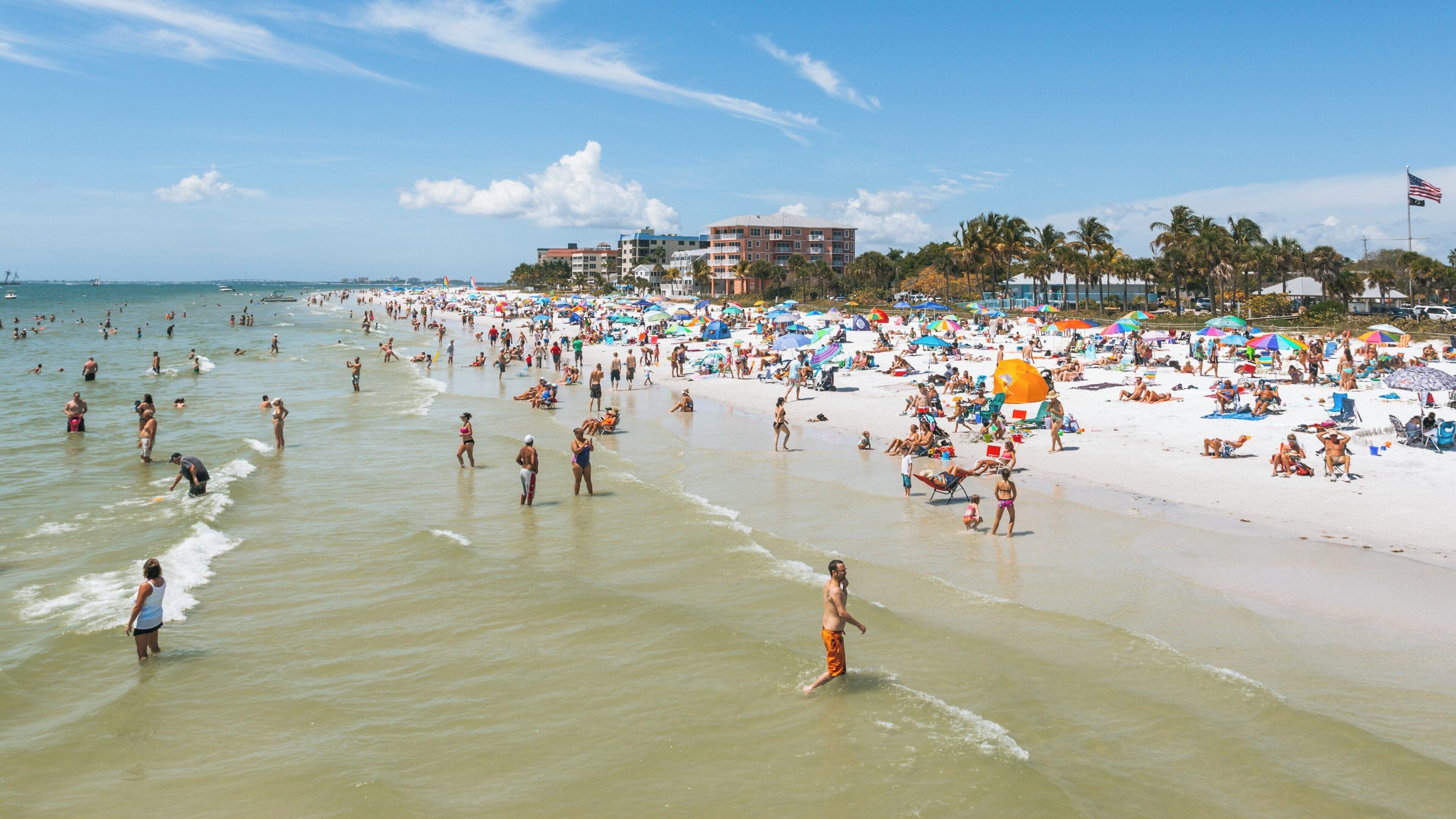Enjoying a sunny day at Henderson Beach State Park in Fort Walton Beach, Florida with families and friends relaxing and playing along the sandy shores