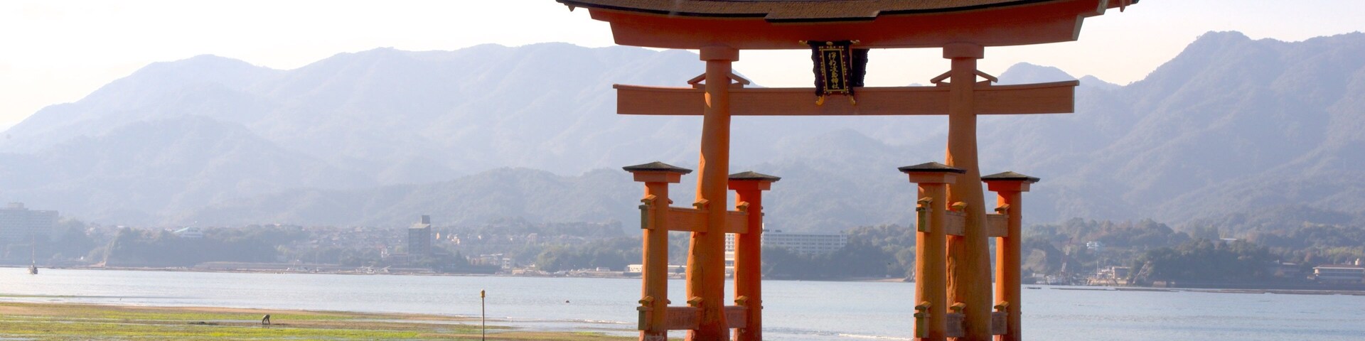 Hiroshima featuring heritage elements and a lake or waterhole as well as a large group of people