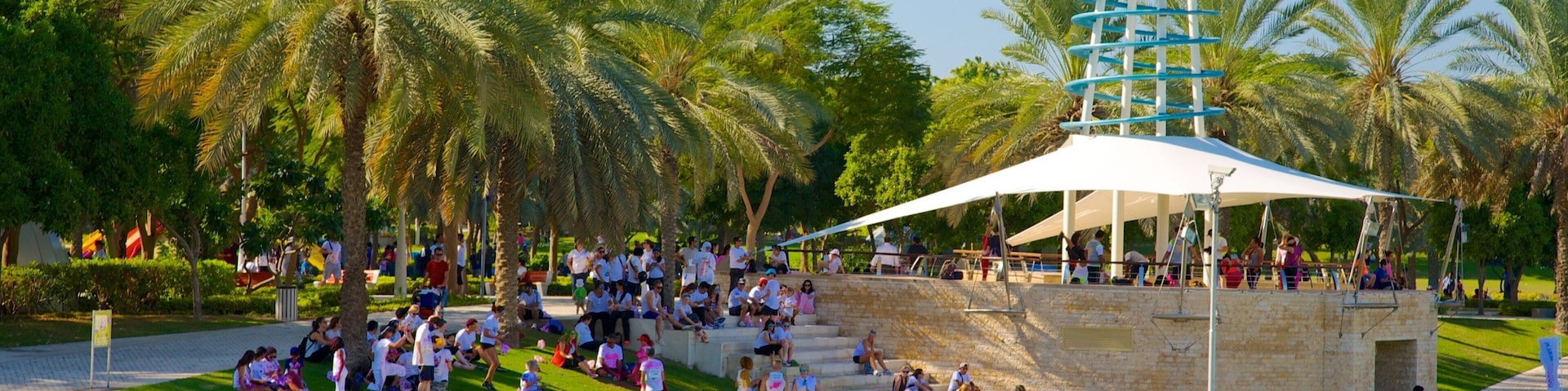 Zabeel Park featuring a park as well as a large group of people