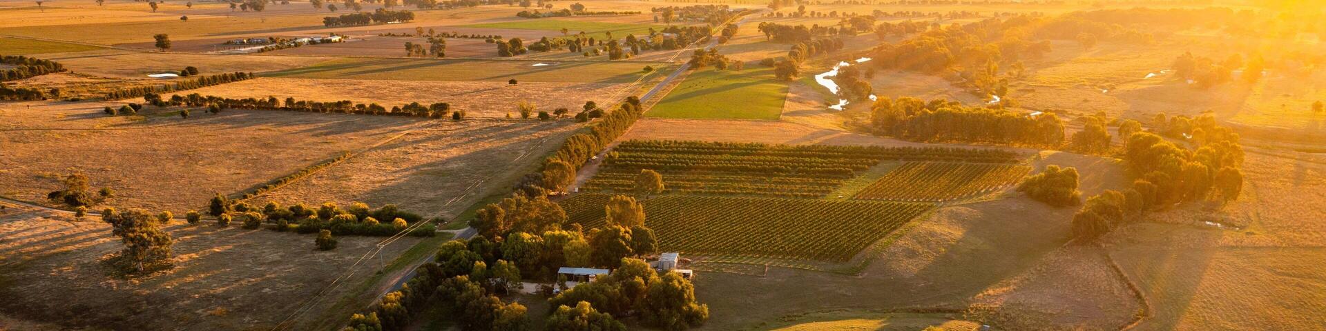 Australia featuring landscape views, a sunset and farmland