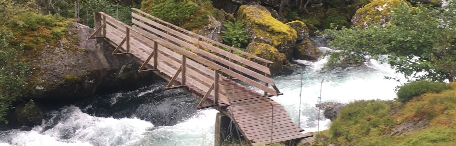 Wooden bridge going over a glacial icefall. This is on a hike from Bondhus/sunndal to Bondhusdalen lake at the bottom of the glacier #takeahike