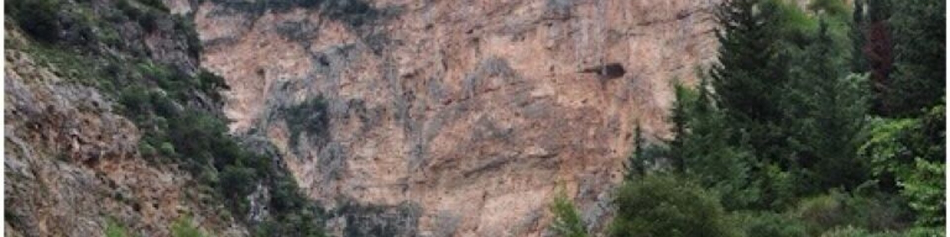 Driving through the gorge of Kleisoura.
The monastery of Panaghia Eleousa is carved in a rock on the gorge's limestone walls.