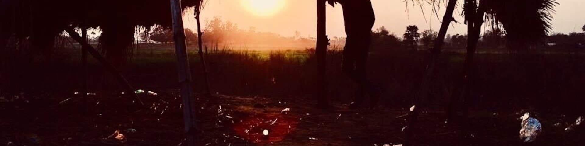 Beautiful sunset under hut. Silhouette