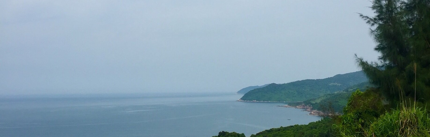 View from the Hai Van Pass, a 21km mountain pass between Hue and Danang, Vietnam. It's known to be one of the best coastal roads in the world. Best to do on motorbike or motorcycle - but only if you're comfortable enough!