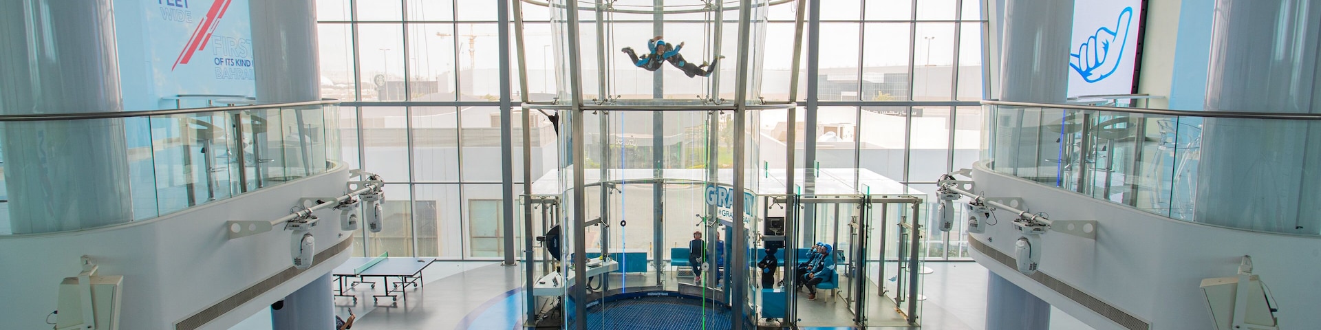 Zallaq featuring interior views and skydiving