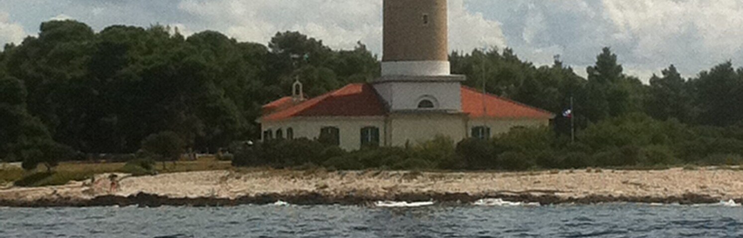 On the way to Saharun, one of the most famous Croatian beaches, you will pass near lighthouse Veli Rat. 
You can rent an apartment in the lighthouse. It would be great to wake up few steps from the sea! Don't you think?