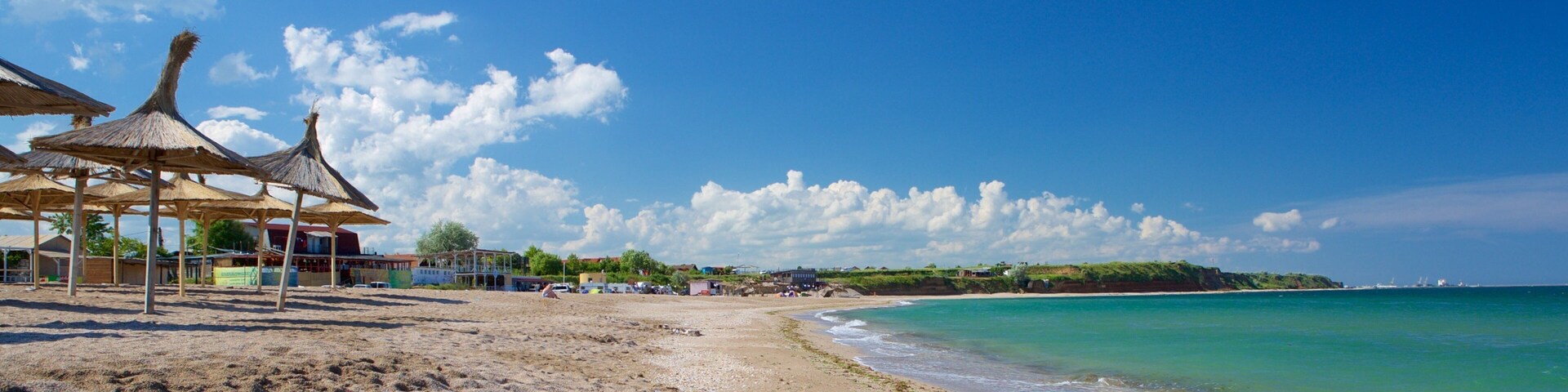 Vama Veche which includes general coastal views and a beach