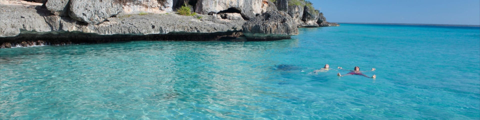 Bayahibe Beach which includes general coastal views, tropical scenes and rocky coastline