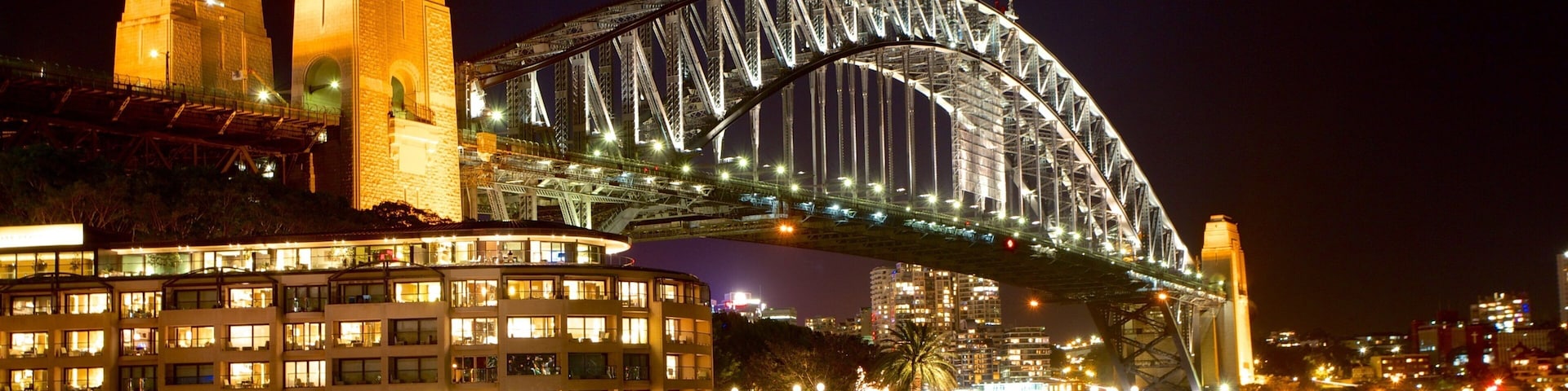 Circular Quay - The Rocks showing a city, night scenes and a bay or harbor