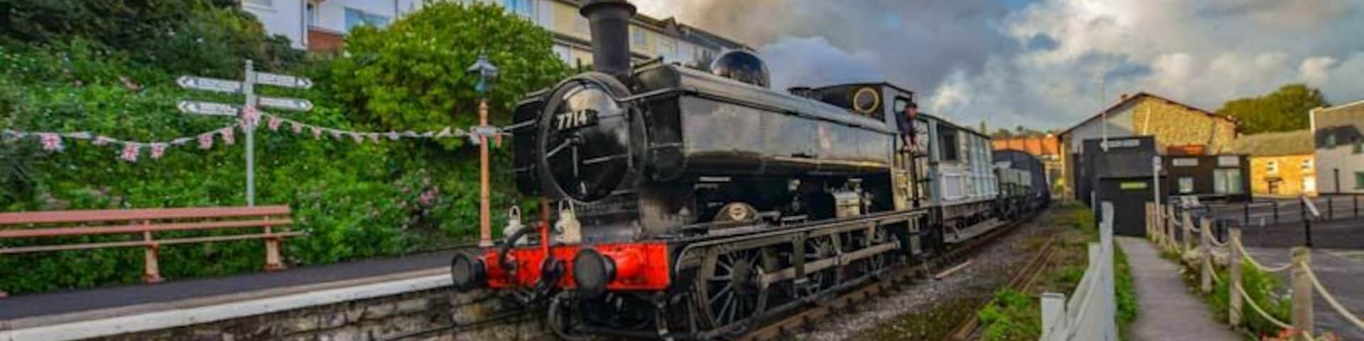 Gala day on the West Somerset Railway and an early morning steam hauled goods train passes Watchet station.