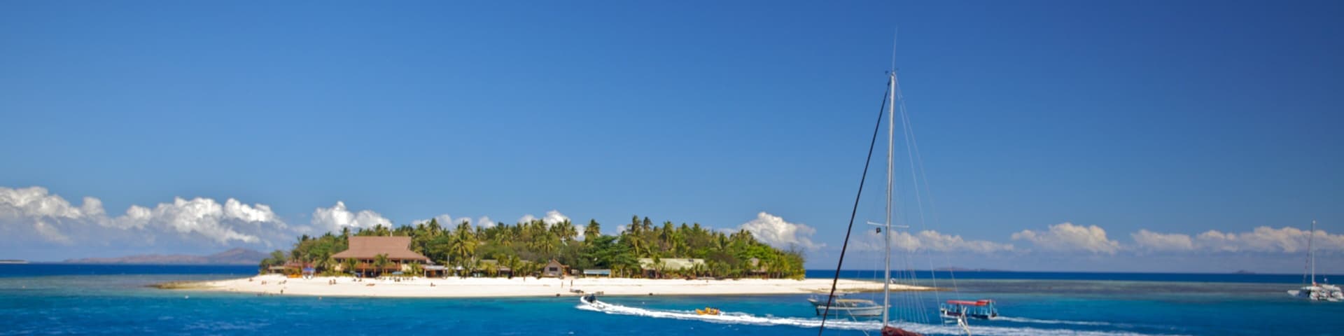 Fiji which includes boating, sailing and tropical scenes
