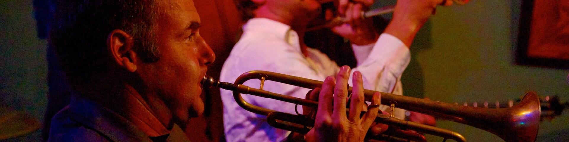 Jazz musicians perform soulful tunes at Frenchmen Street clubs in New Orleans during a lively evening