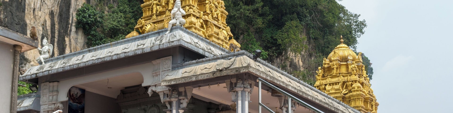 There is more to Batu Caves than the main cave, there are a couple of other caves and temples such as this one which comes with free a monkey guide. #detail #Macaques #Batu Cave #Temple #Malaysia #Kuala Lumpur