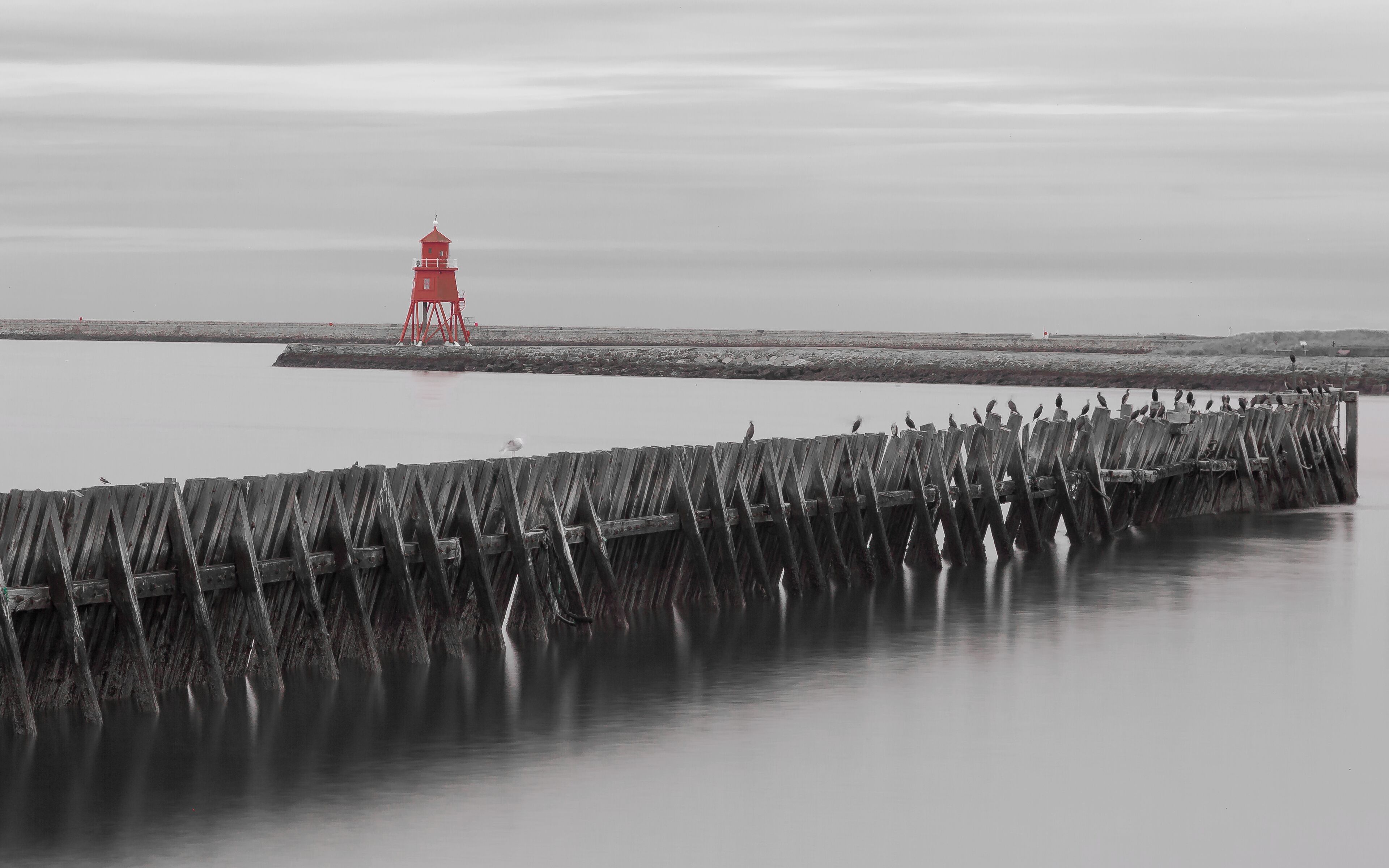 The Herd Lighthouse at South Shields and jetty at North Shields near the fish quay