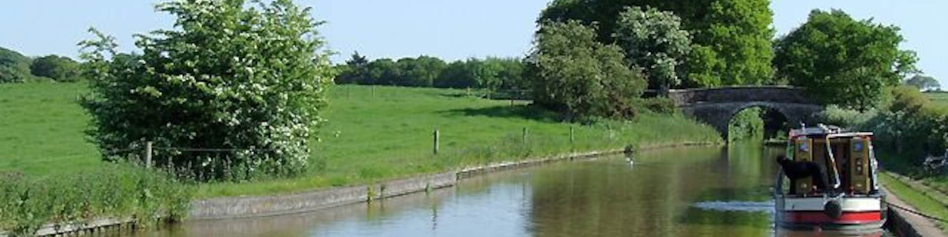 Shropshire Union Canal near Market Drayton, Shropshire. Approaching Tyrley Castle Bridge.