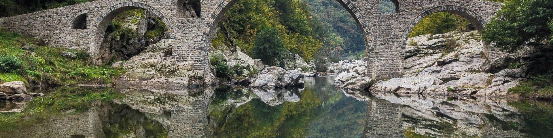 Beautiful old bridge over river Arda in mountains Rodopi close to city Ardino. Very quiet place