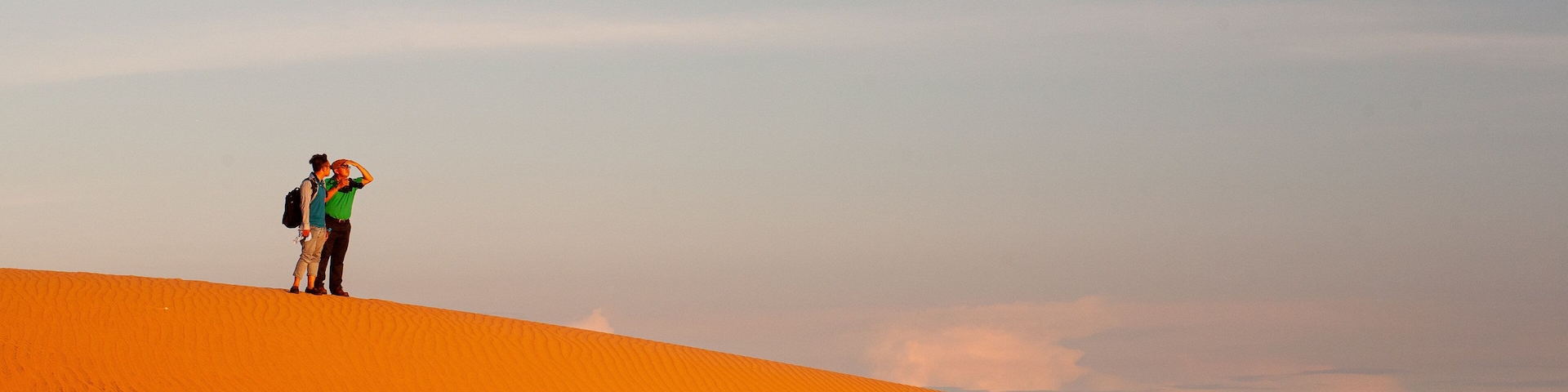 Mui Ne Sand Dunes which includes a sandy beach as well as a couple