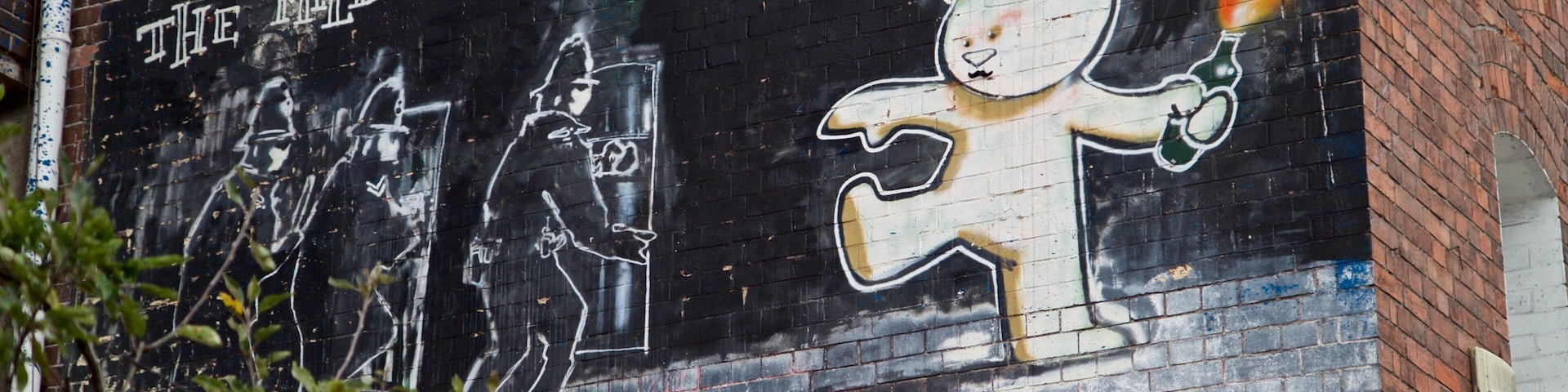 Banksy Graffiti Mild Mild West which includes outdoor art