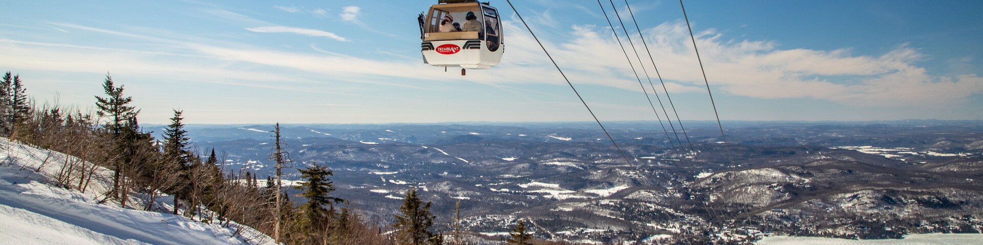 Express Gondola featuring snow, landscape views and a gondola