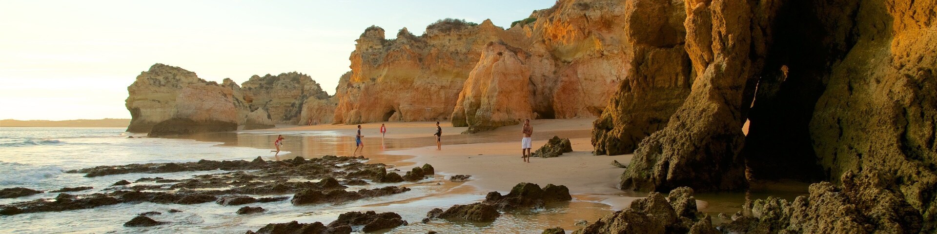 Tres Irmaos Beach showing a sunset, a sandy beach and general coastal views