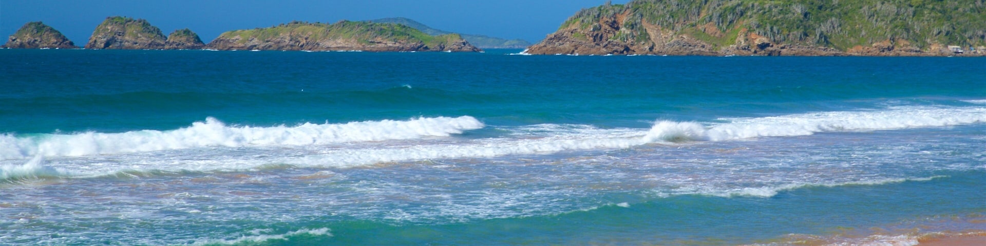 Tucuns Beach showing a sandy beach and general coastal views