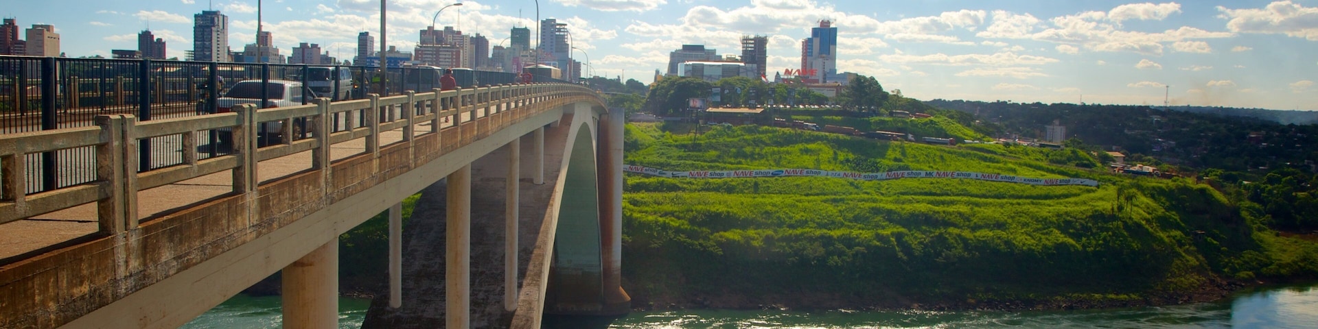 Friendship Bridge featuring landscape views, a river or creek and a city