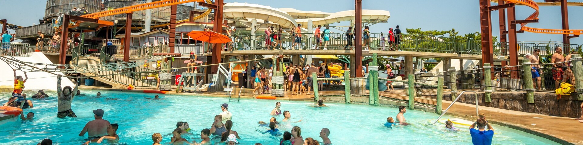 Raging Waters showing a waterpark and swimming as well as a large group of people