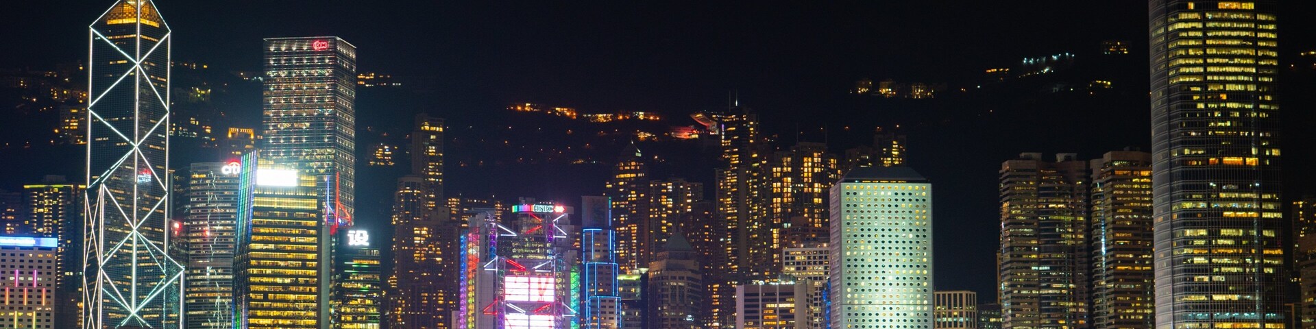 Victoria Harbour which includes a city, night scenes and a bay or harbor
