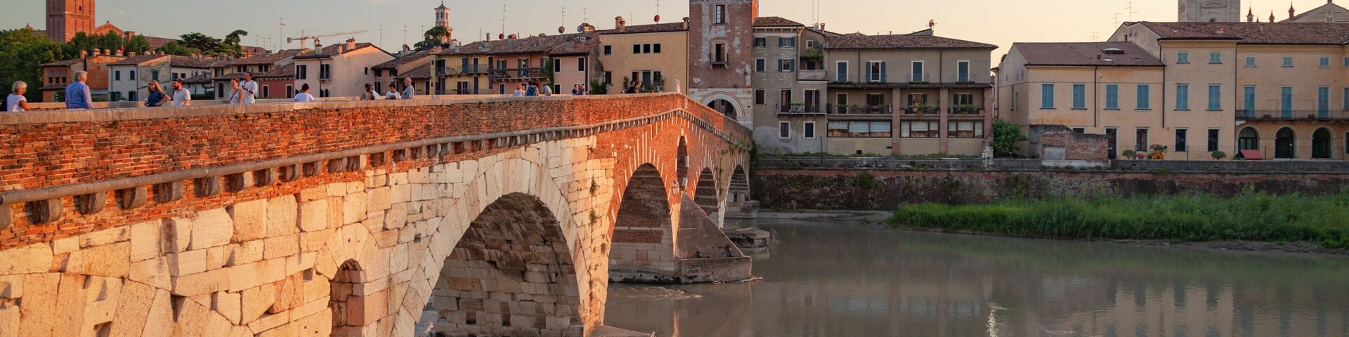 Adige River showing a river or creek, a sunset and a bridge