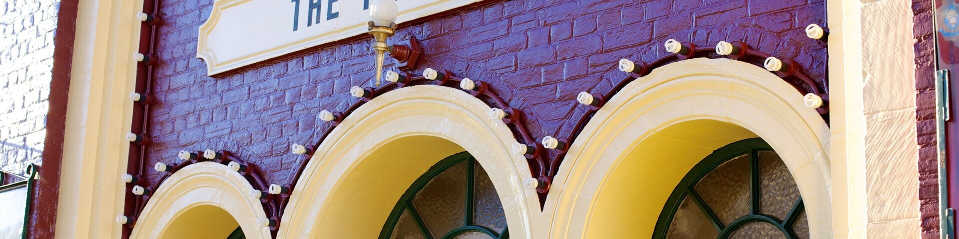 Playhouse Theatre which includes signage and theater scenes