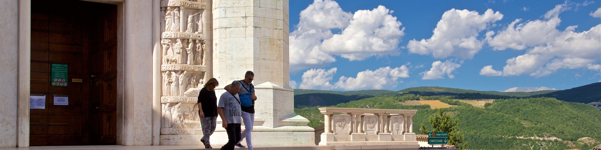 Basilica di Santa Rita which includes heritage elements and views as well as a small group of people