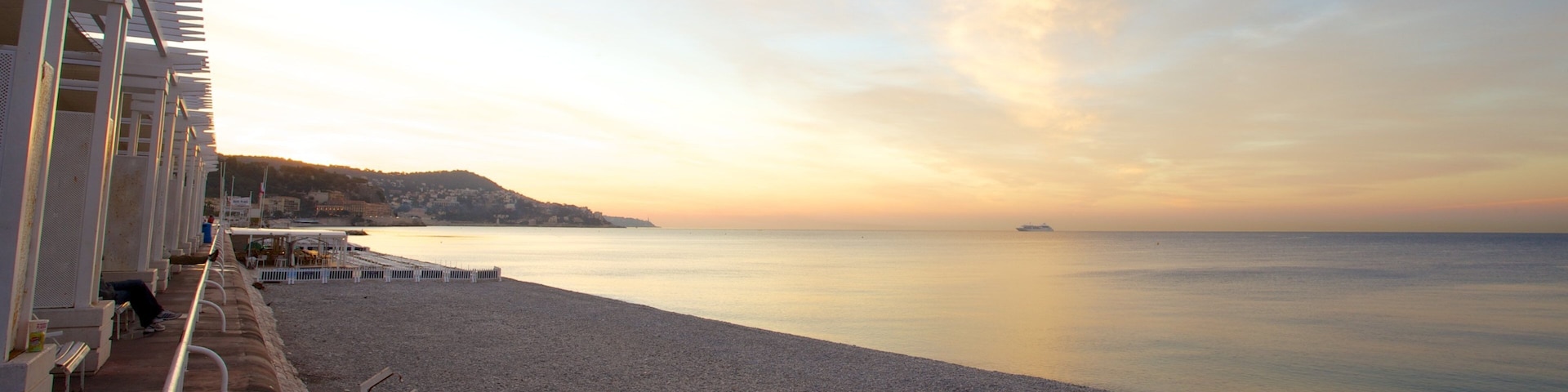 Nice showing a sandy beach, a pebble beach and a sunset
