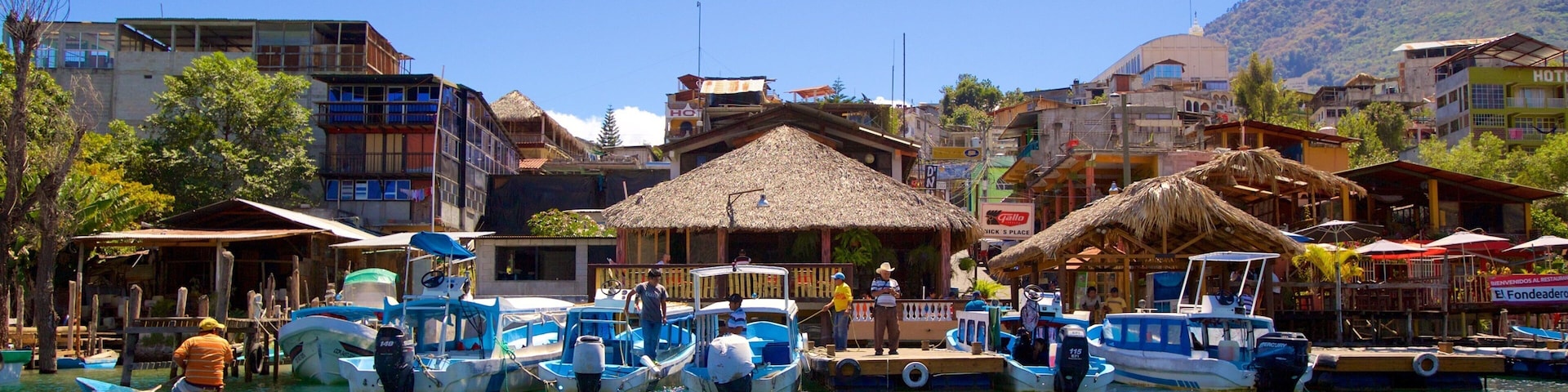 Santiago Atitlan showing a coastal town and a bay or harbor