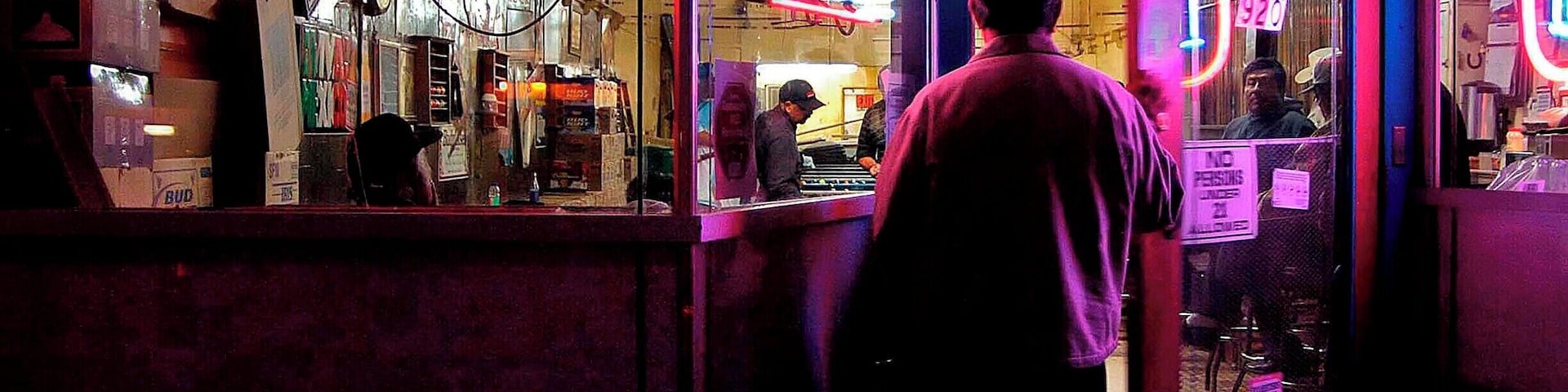 Guadalupe, CA. -March 2016: Field hands
Field workers entertain themselves on a Saturday night at the local Pool Hall, one of the only places available to them in this small farming community of Guadalupe on the central coast of California.
(Photo by Robb/Robb Image)