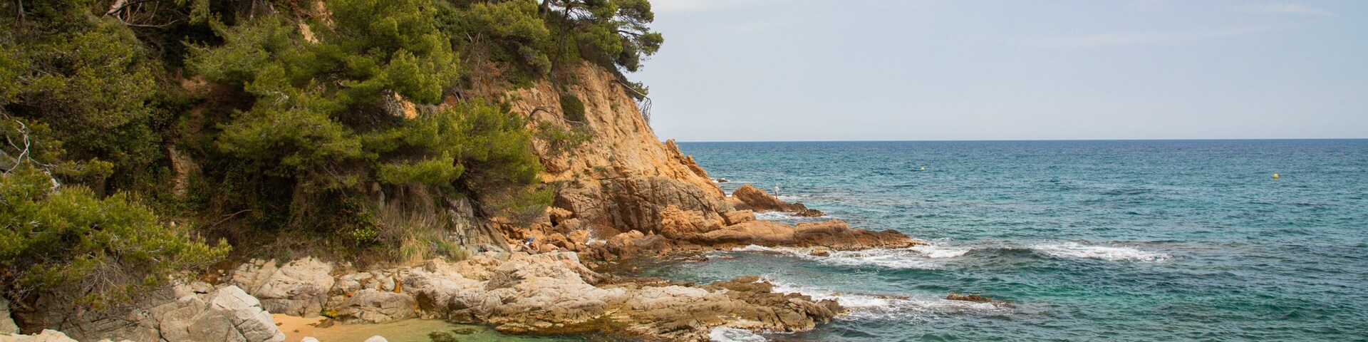 Cala Boadella Beach showing general coastal views and rugged coastline