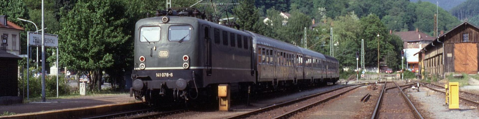 141.078 on train 7753, 17:36 Zell (Wiesental) to Basel Badischer Bf as seen on 22 May 1992.